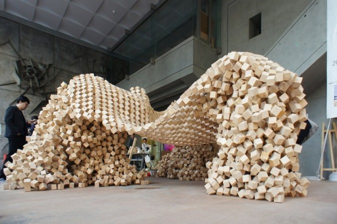 7000 wooden cubes linked together in an inverted question-cube | Spoon ...